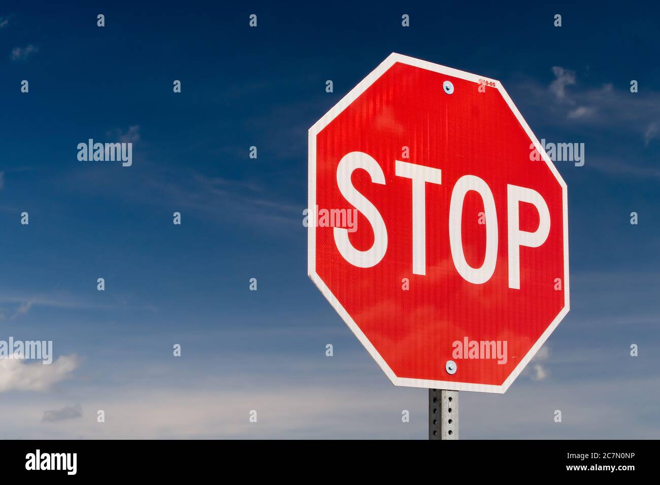 Stop sign with blue sky Stock Photo - Alamy