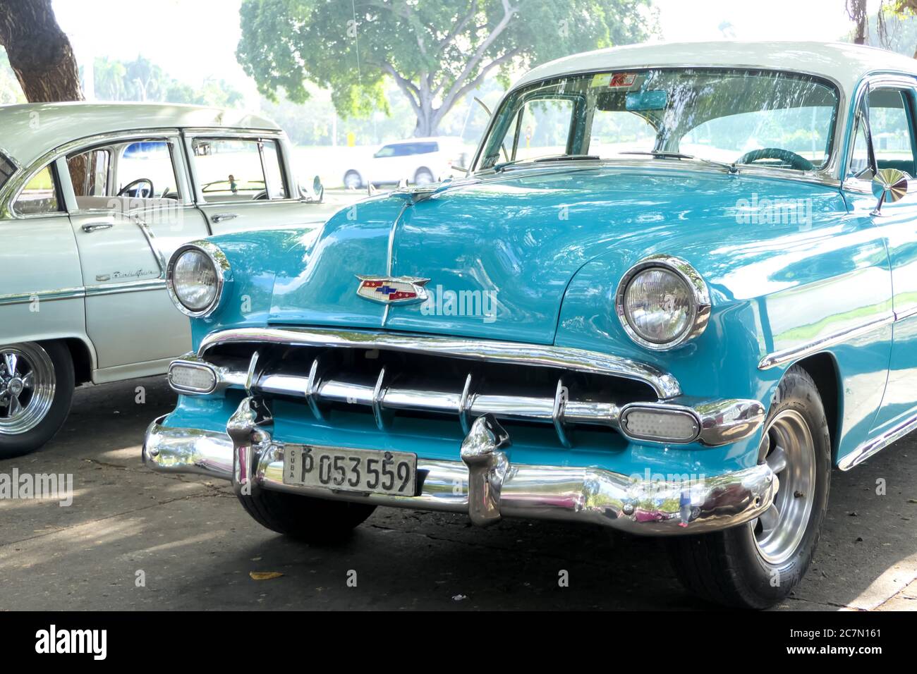 Up close view of a teal colored classic Cuban car. Featuring the front ...