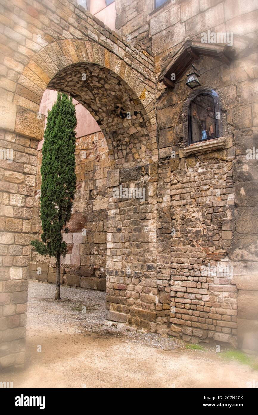 An archway bridge connecting two buildings across from each other on a ...