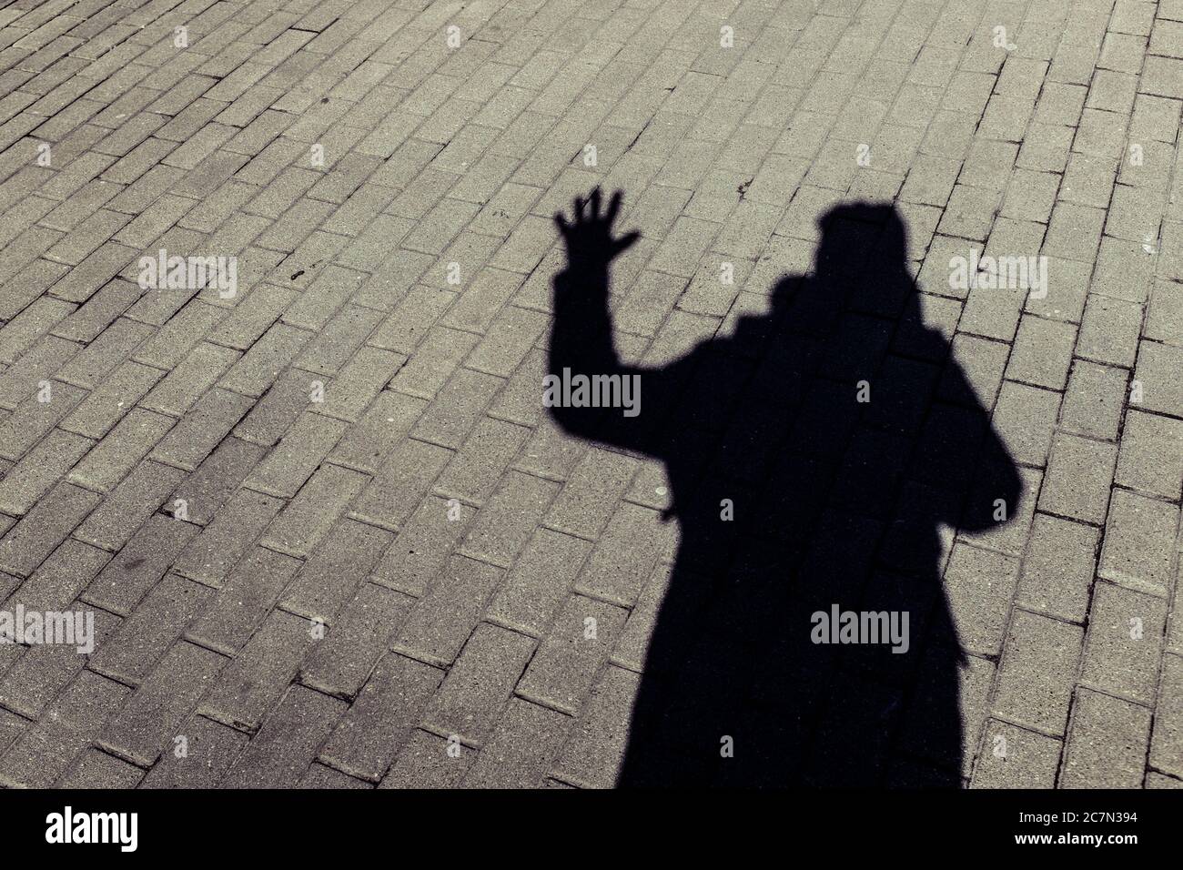 Human shadows on the ground hi-res stock photography and images - Alamy