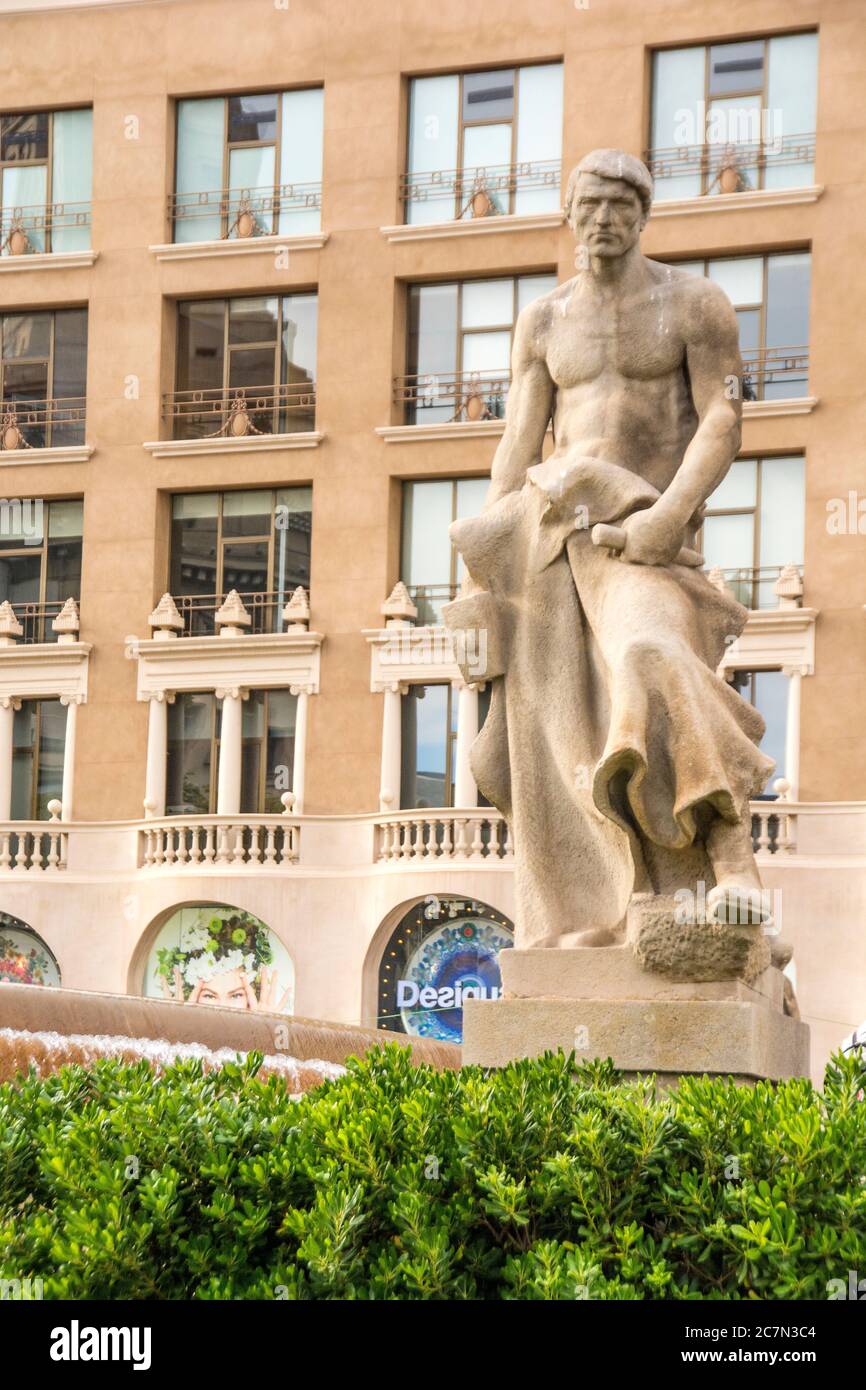 Statues, buildings and fauna dot the landscape of the Cataluna Plaza in ...