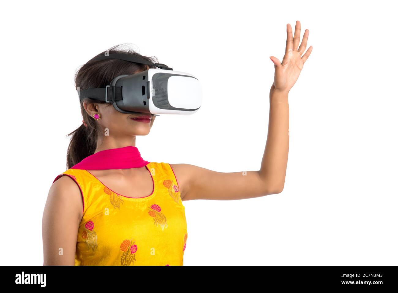 Indian traditional young girl holding and showing VR device, vr box ...