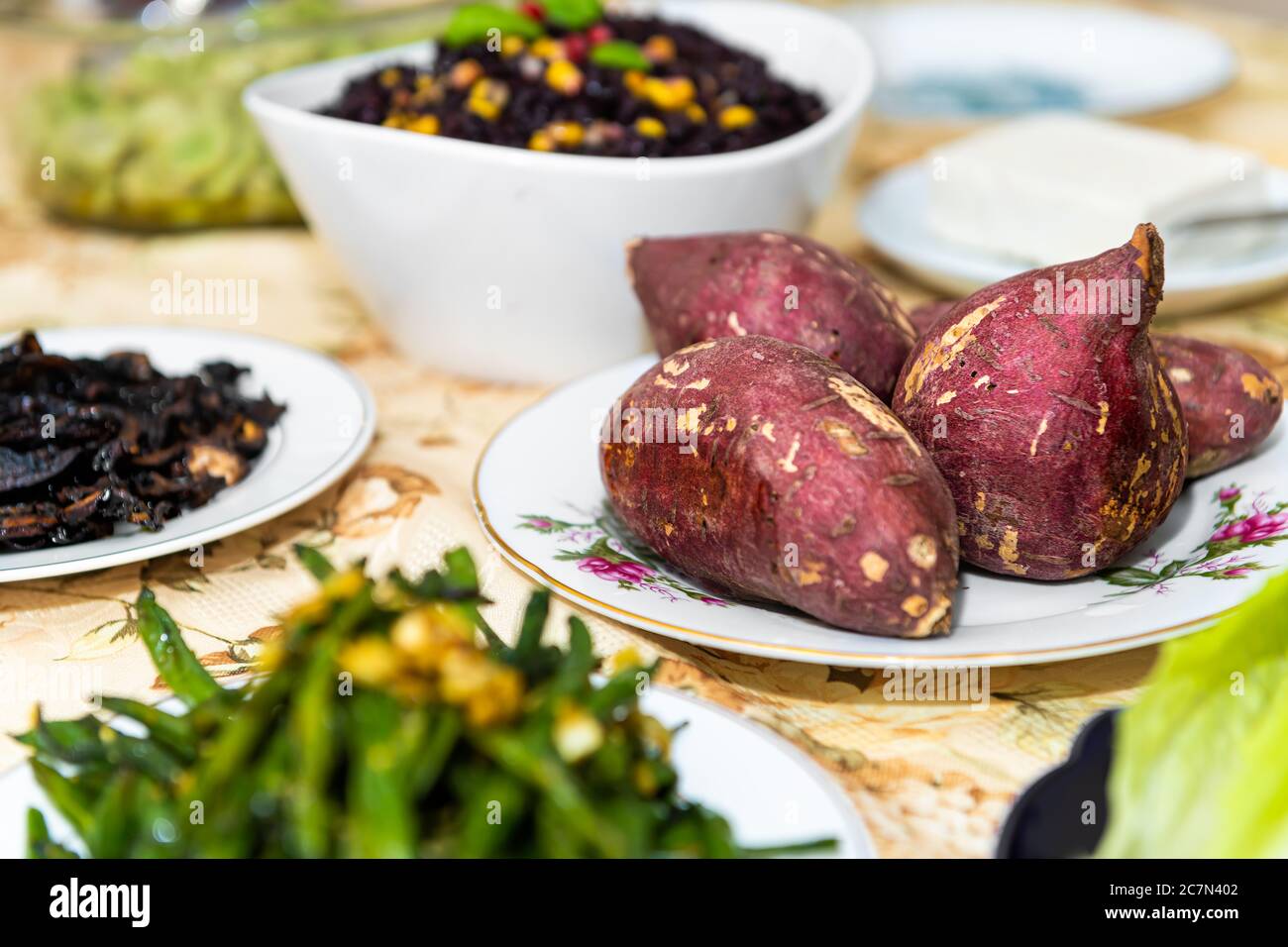 Table with closeup of setting of healthy vegan vegetarian Thanksgiving ...