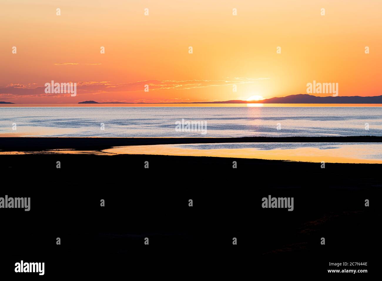 Sun path reflection sunset on Great Salt Lake in Antelope Island State ...