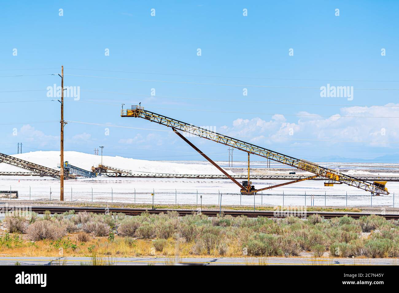 Salt Lake City, Utah landscape with desert salt mining factory at lake ...