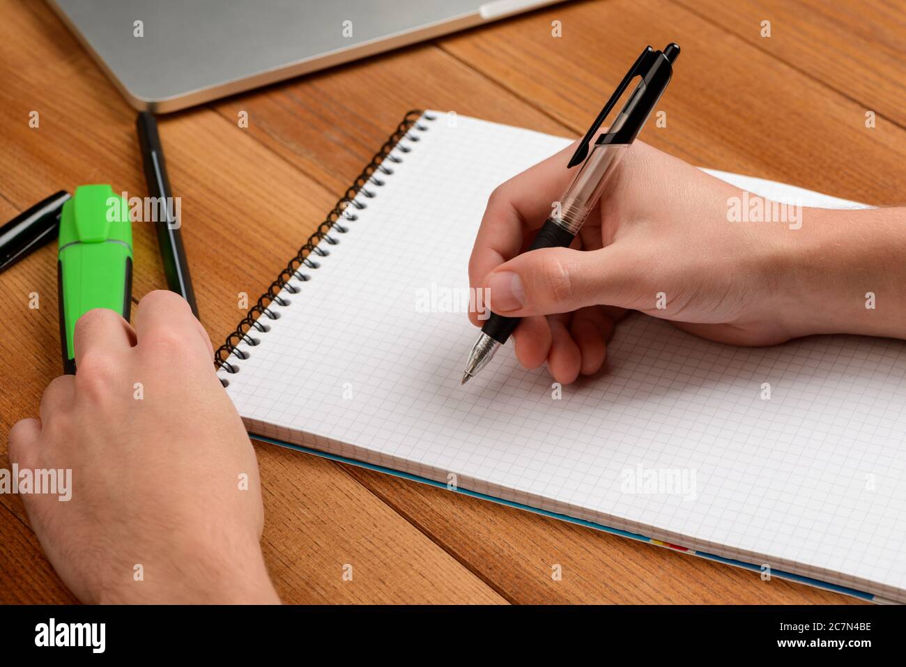 Student writing in the notepad. Making notes and studying Stock Photo ...