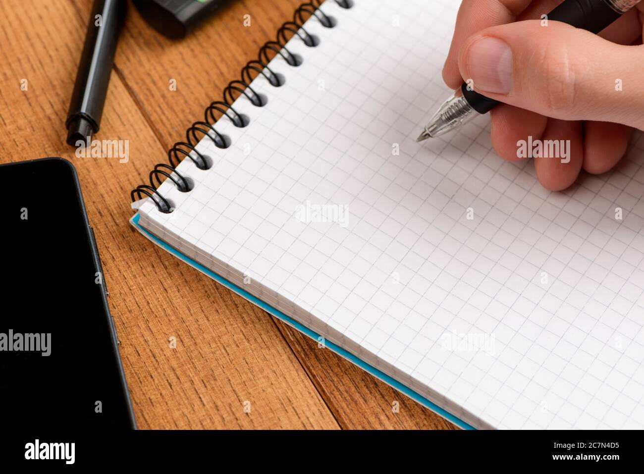 Writing in a notepad. Close up on a male hand leaving a note Stock ...