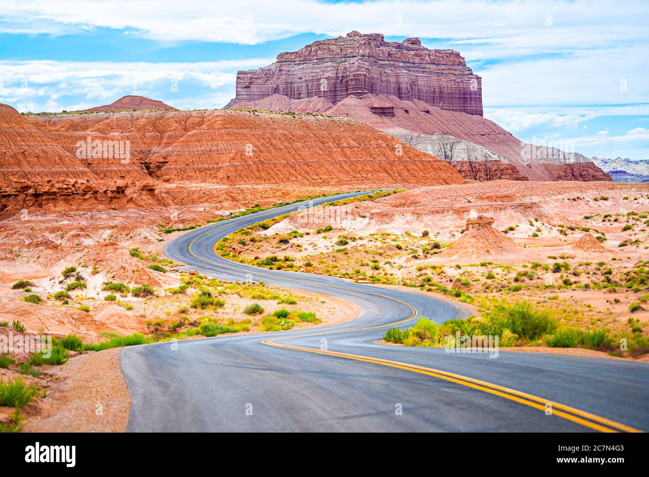 Curvy winding road and red sandstone rock formations desert landscape ...