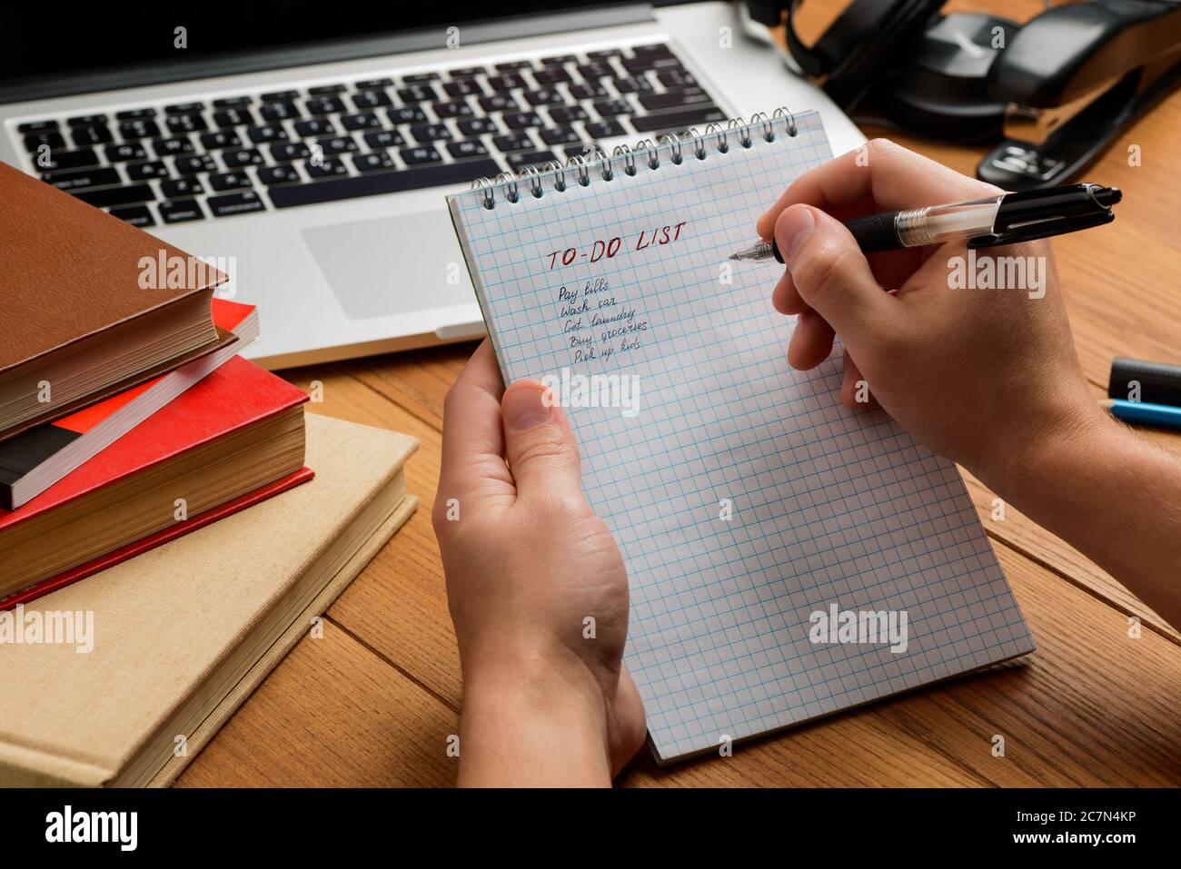 Man writing a to do list in a notepad Stock Photo - Alamy
