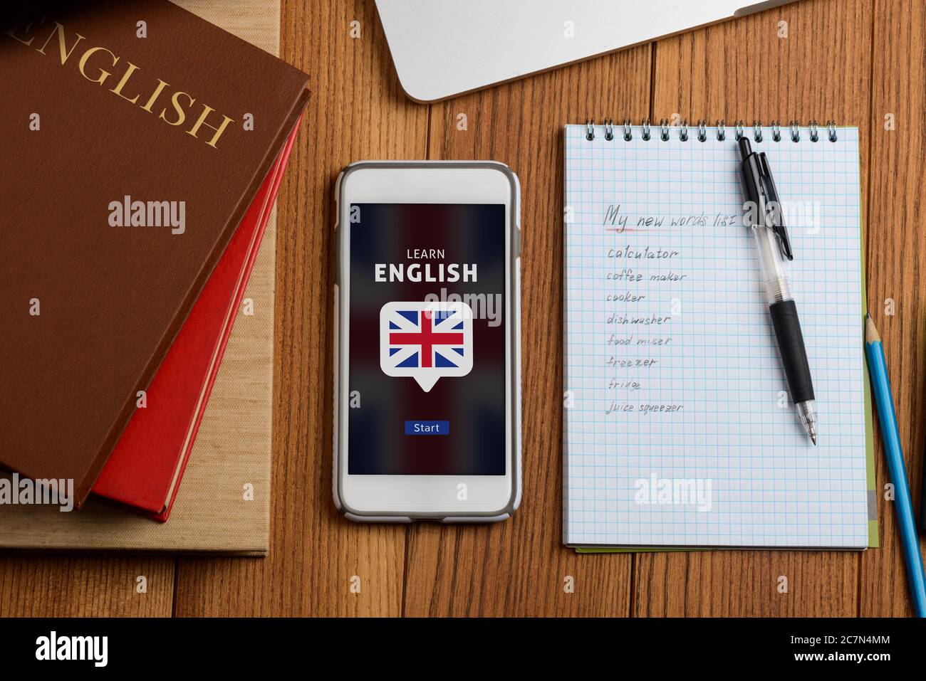 Learning English concept. Student books and online app Stock Photo - Alamy