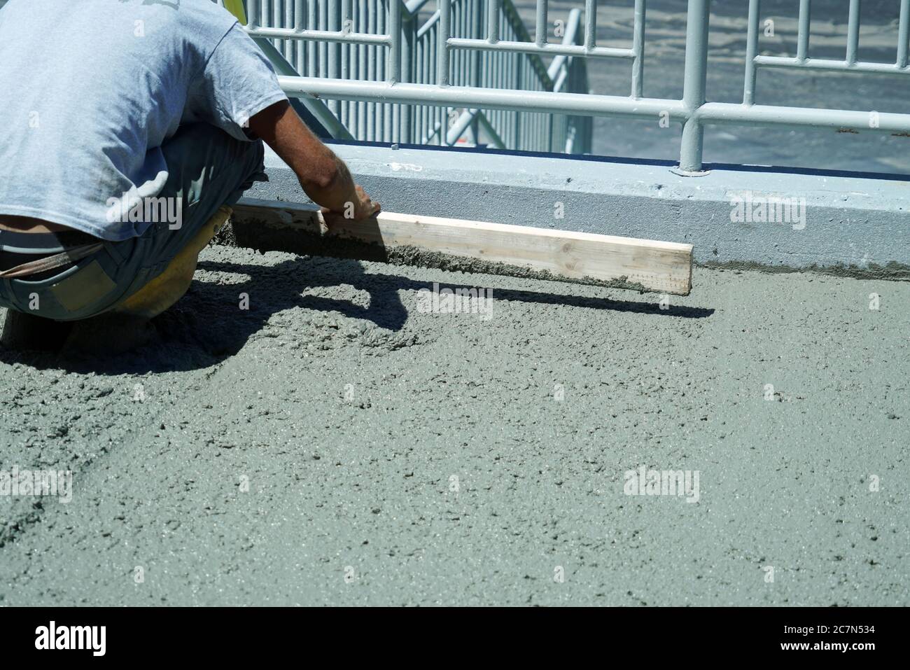 Worker leveling wet concrete hi-res stock photography and images - Alamy