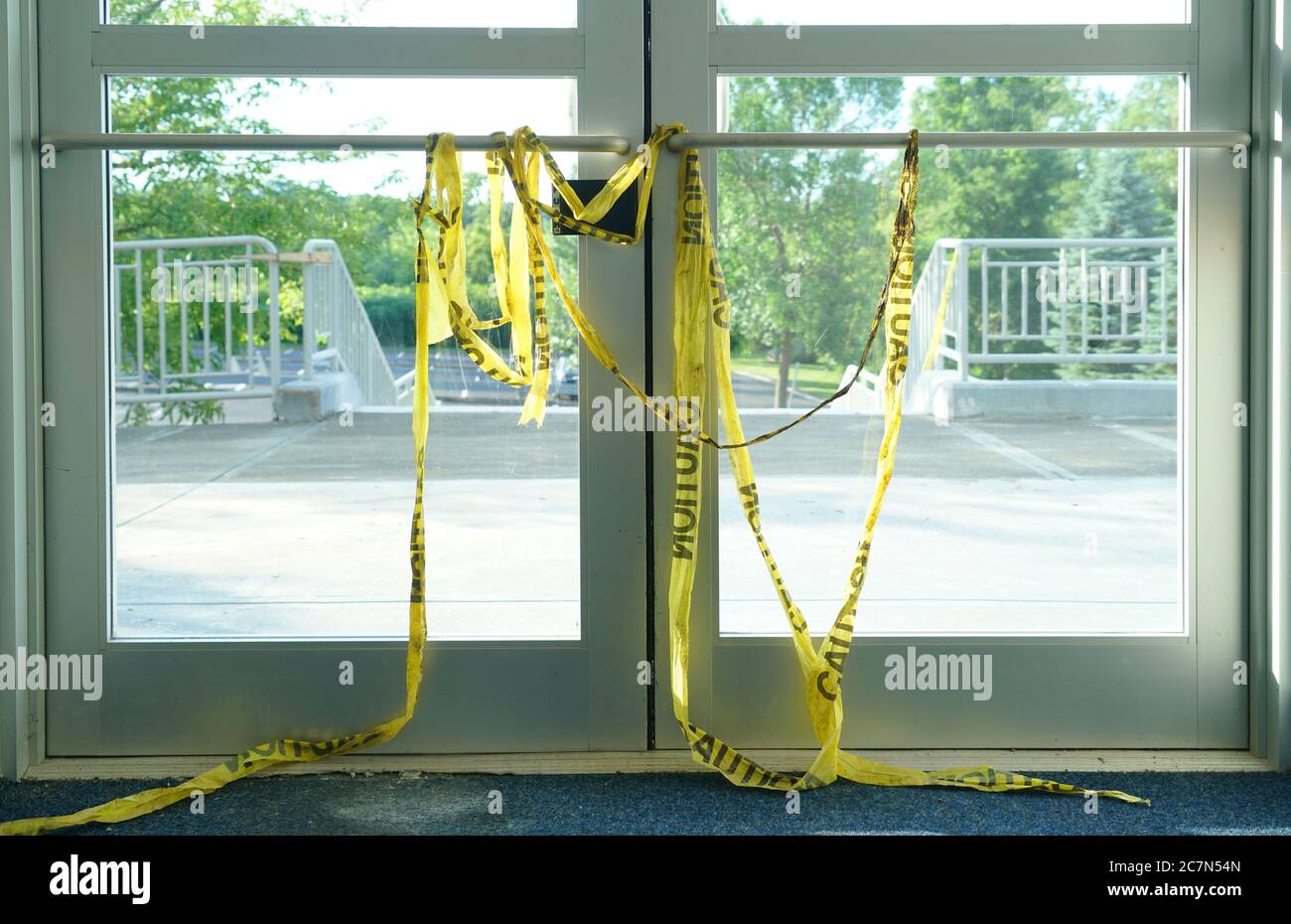 glass door with caution warning stripe on the door Stock Photo - Alamy