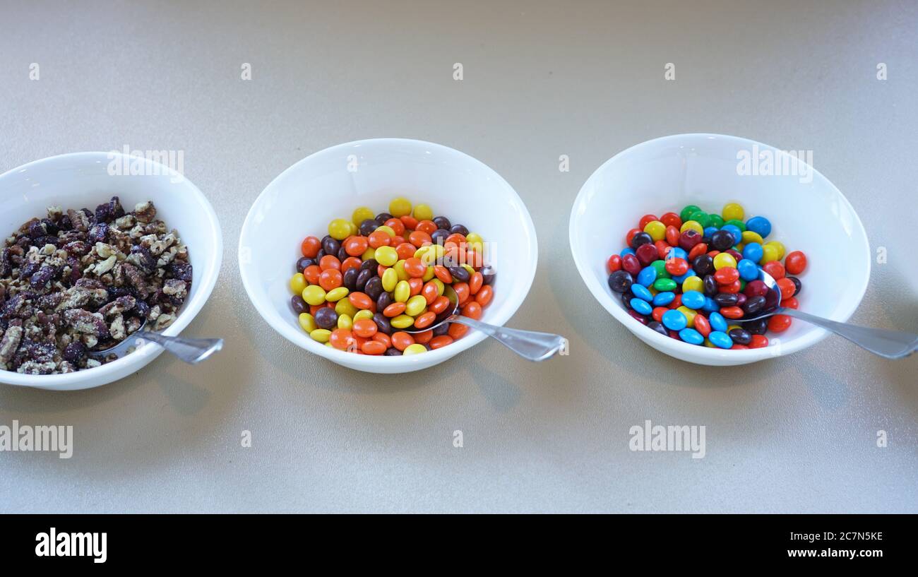 colorful candy inside white bowls Stock Photo - Alamy