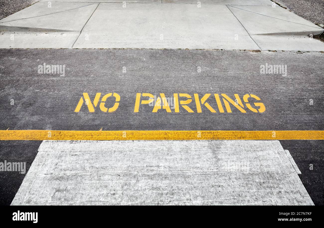 Yellow no parking sign painted hi-res stock photography and images - Alamy