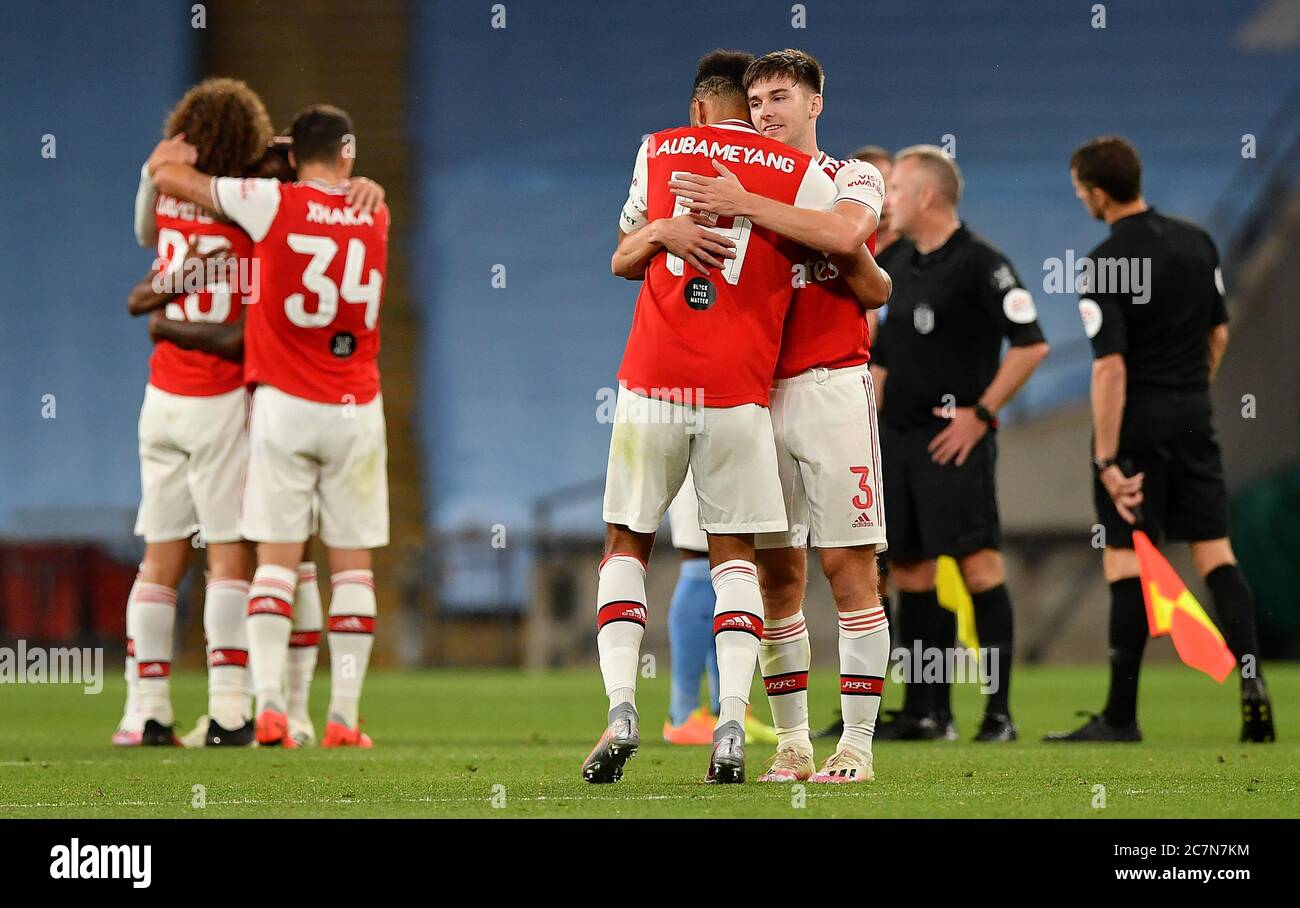 Arsenal's Kieran Tierney (right) and Pierre-Emerick Aubameyang embrace ...