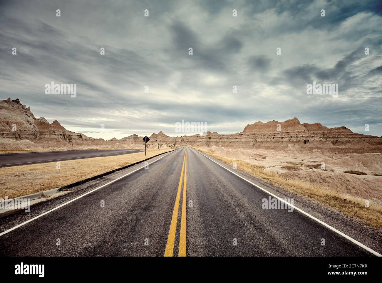 Scenic road in Badlands National Park, color toning applied, travel ...
