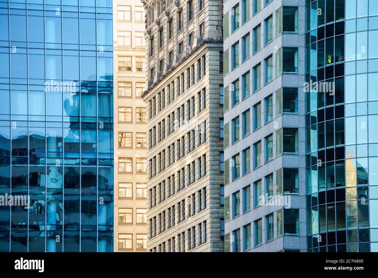 modern styled skyscraper with blue and green windows Stock Photo - Alamy