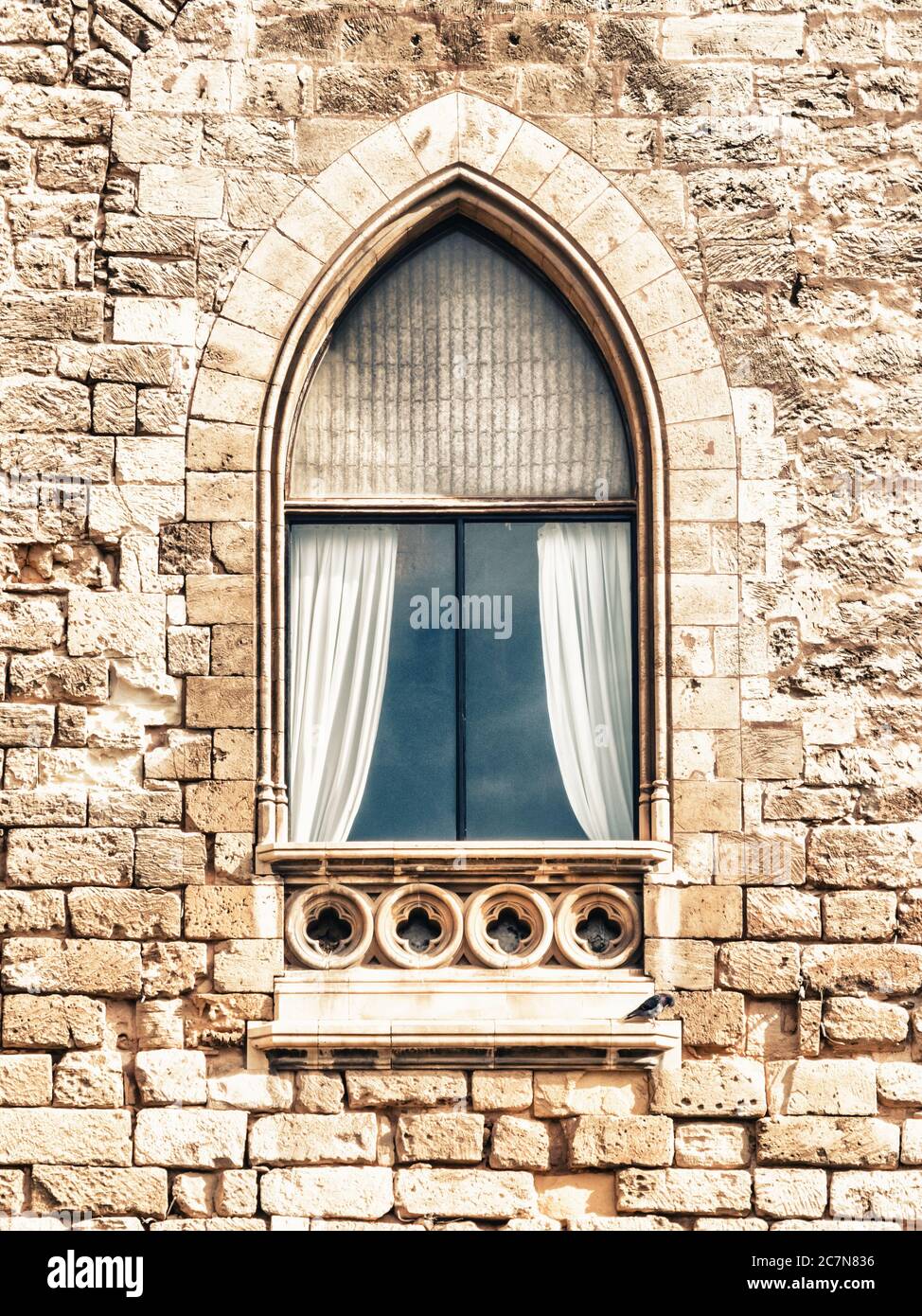 Beautiful medieval style arch window with white curtains Stock Photo ...