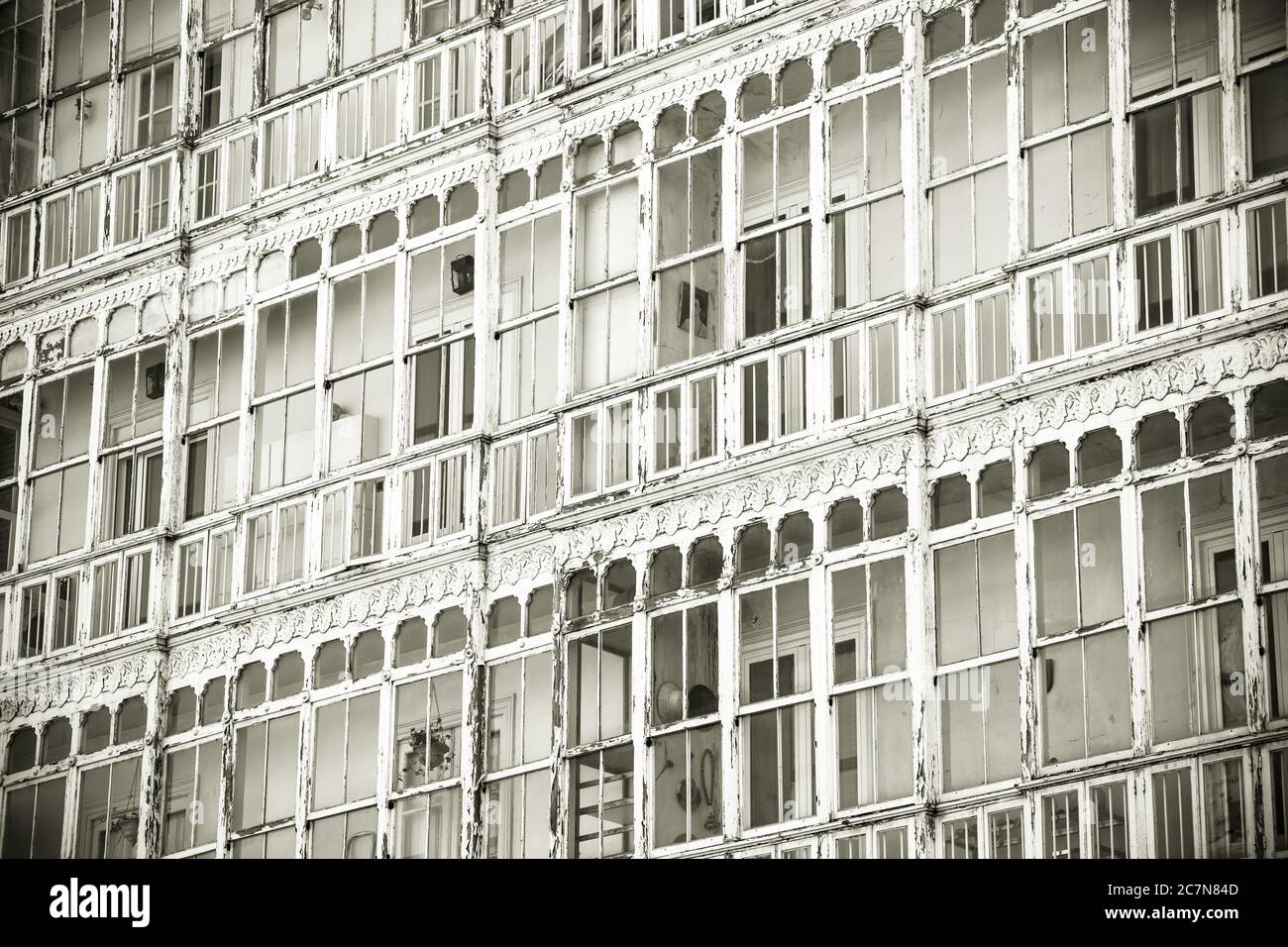 Old and aged building with wooden windows and wooden balconies Stock ...