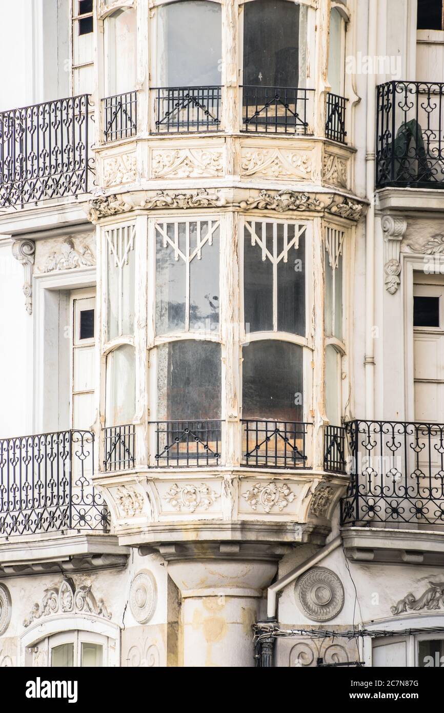 Old and aged white beautiful building with balconies Stock Photo - Alamy