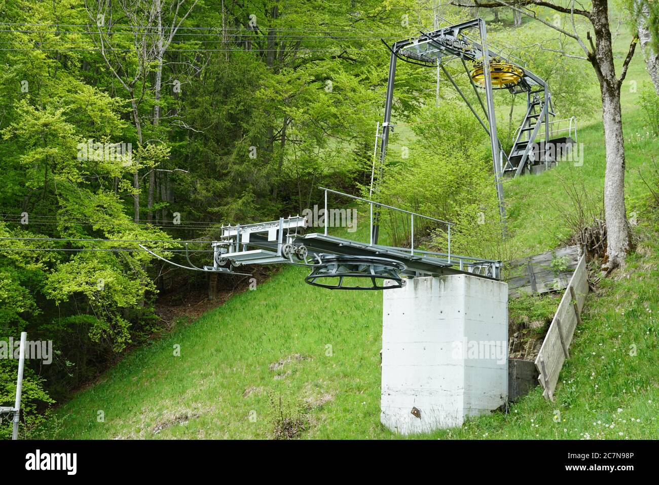 A small ski lift technology installed on a hill. In summer it is out of ...