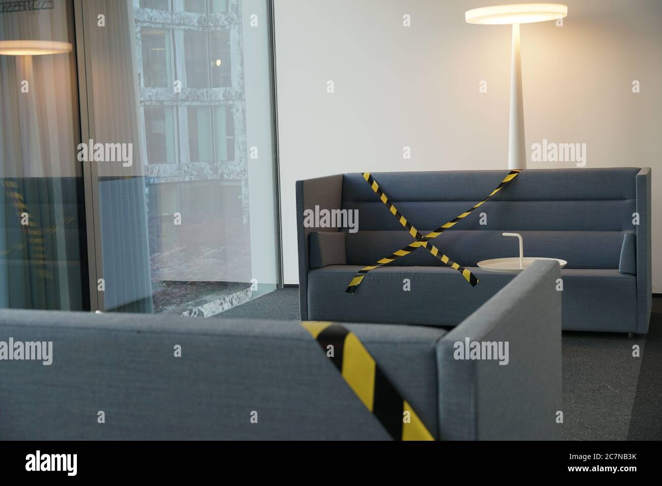 Break space in an office building. The sofas are agjusted to social ...