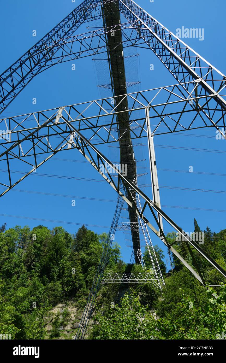 Metal structure of a bridge suspended over an abyss and attached on the ...