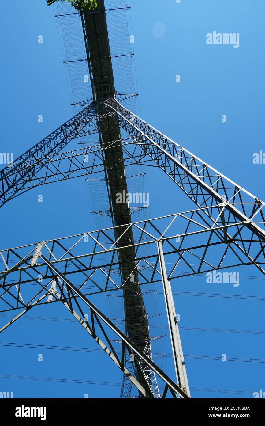 Metal structure of a bridge suspended over an abyss and attached on the ...