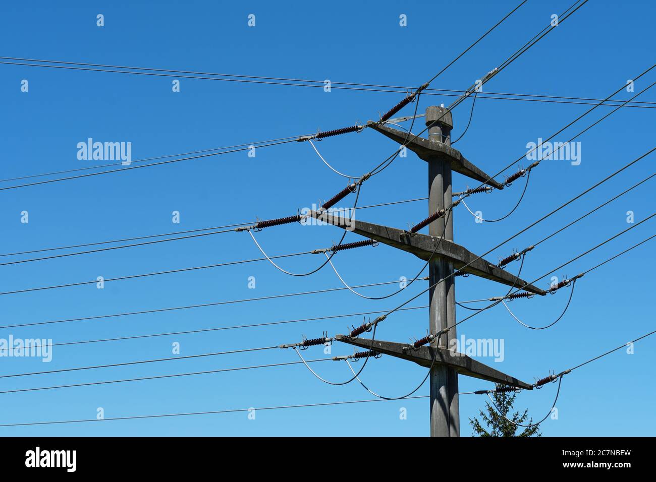 Electric pillar or mast with wires and coils for long distance ...