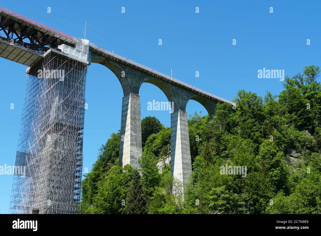 Railway bridge partly in reconstruction one of the concrete pillars is ...