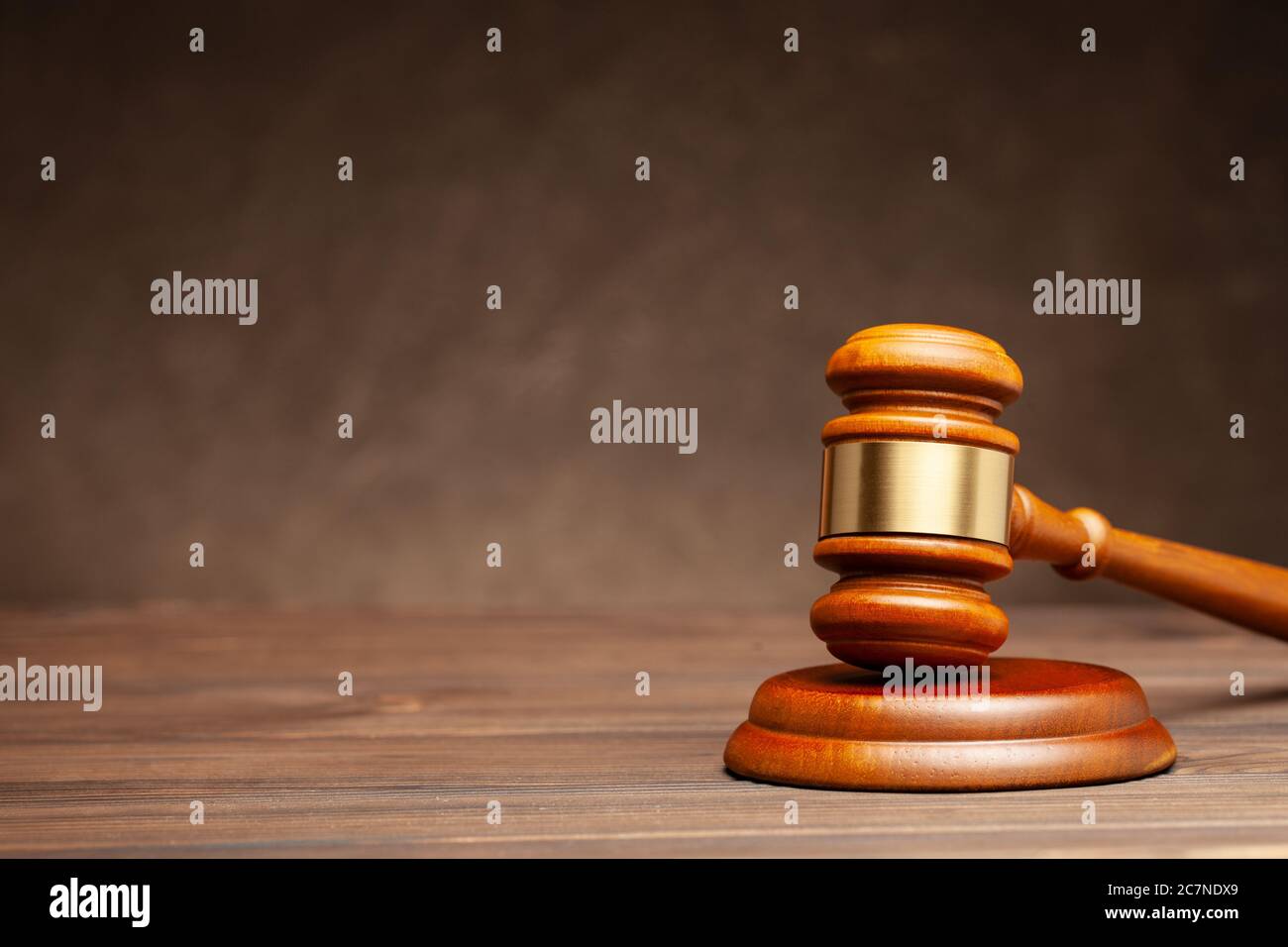 Wooden hammer of the judge. Brown background Stock Photo - Alamy