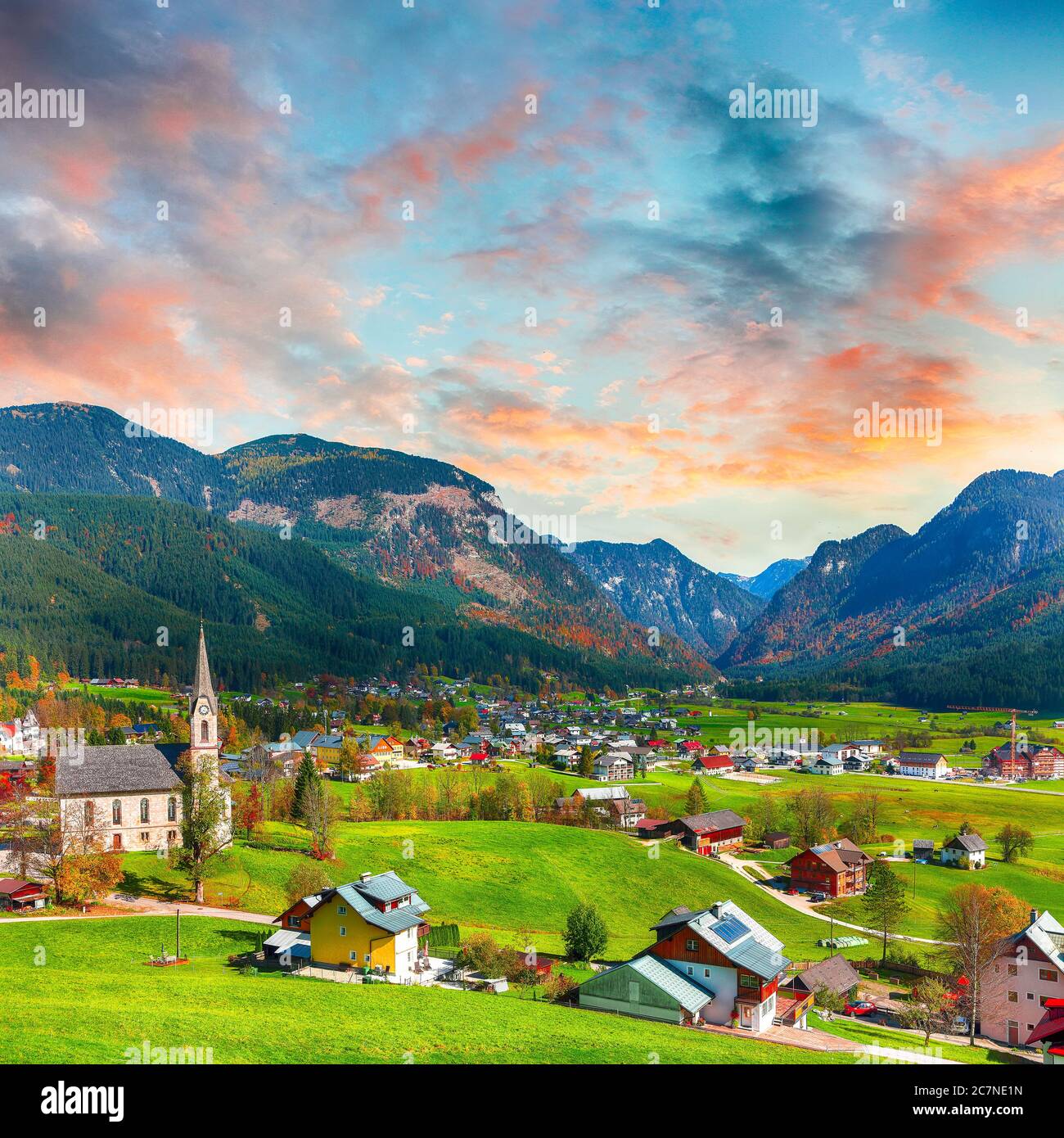 Alpine green fields and traditional wooden houses view of the Gosau ...
