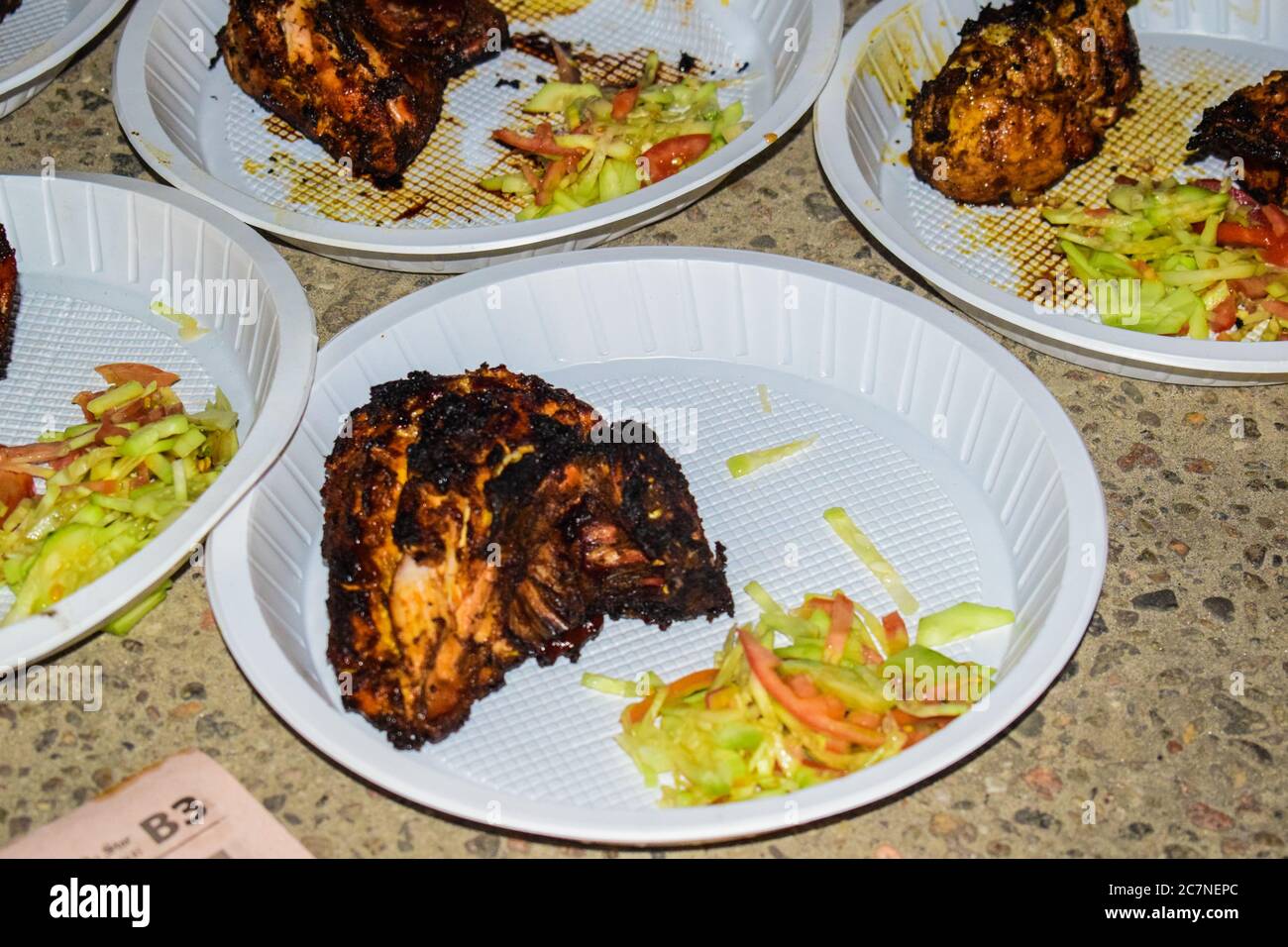 The slightly burned barbecue chicken with a vegetable salad Stock Photo ...