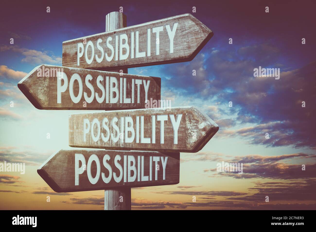 Possibility - wooden signpost, roadsign with four arrows Stock Photo ...