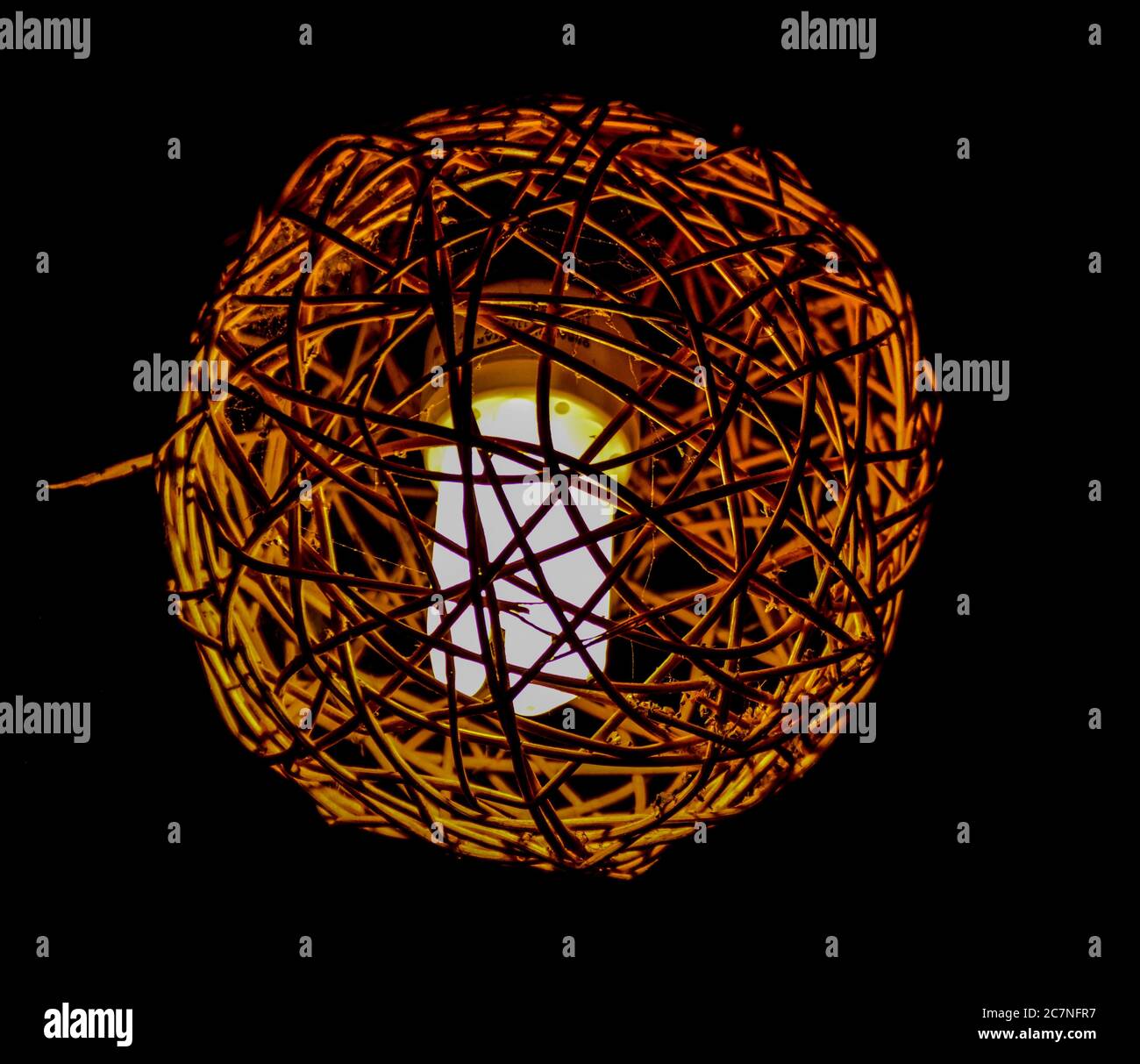 Handmade woven lantern made of wood in a darkness Stock Photo - Alamy