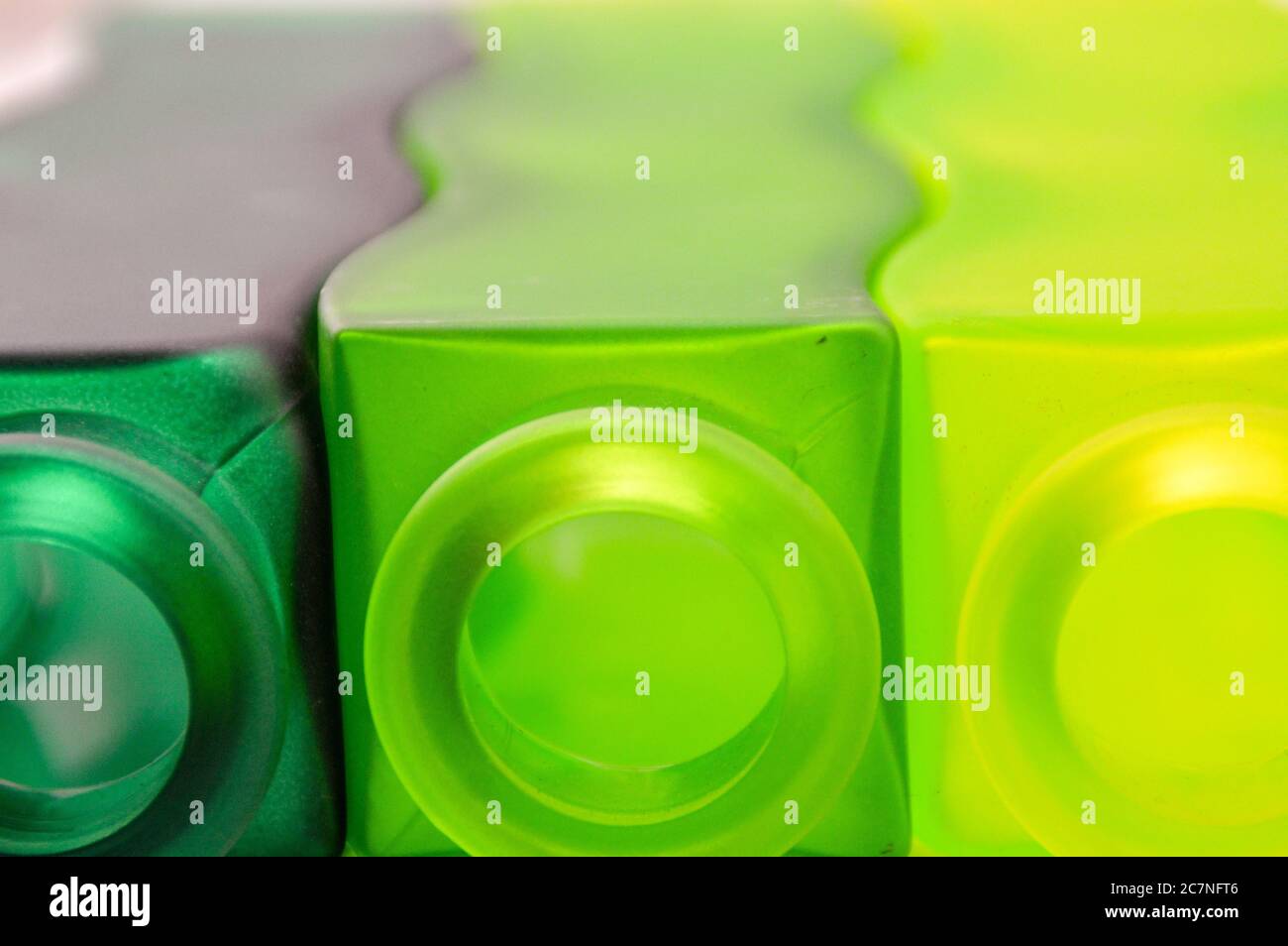 Green translucent bottles made of glass Stock Photo - Alamy