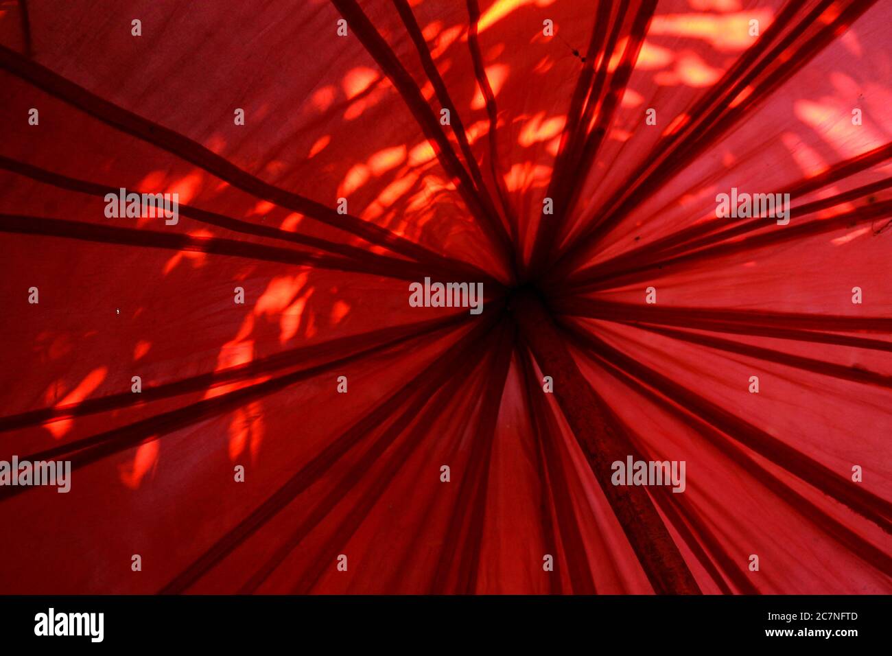 Inside view of a big red umbrella Stock Photo - Alamy