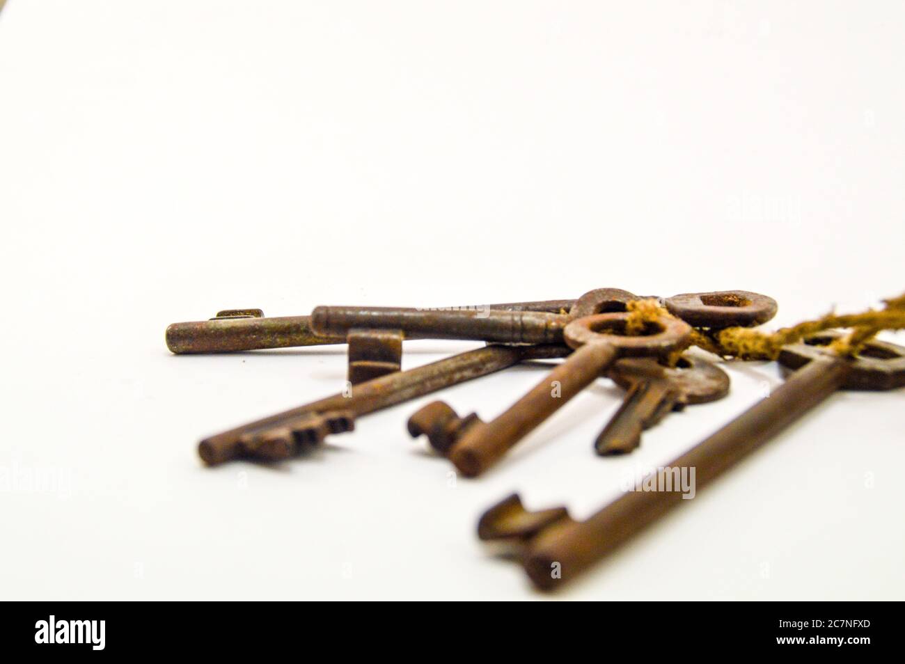 Rusty keys on a white background Stock Photo - Alamy