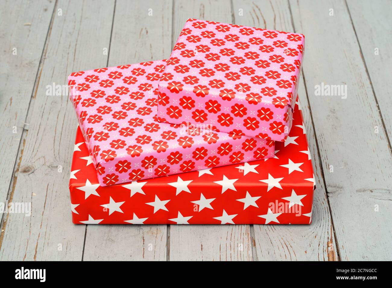 Closeup shot of three gift boxes stacked on top of each other on a ...