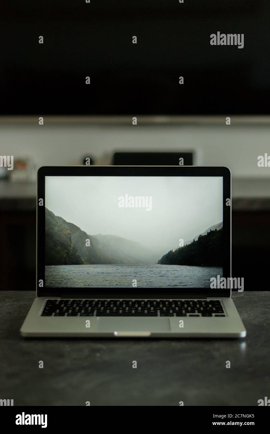 Modern gray laptop with black keyboards on a gray surface Stock Photo ...