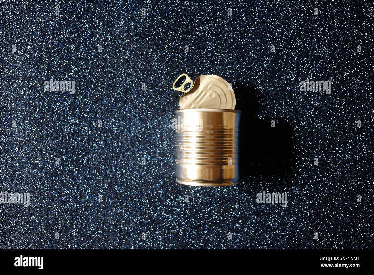 Top view of an opened and emptied out tin can on a blue surface Stock ...