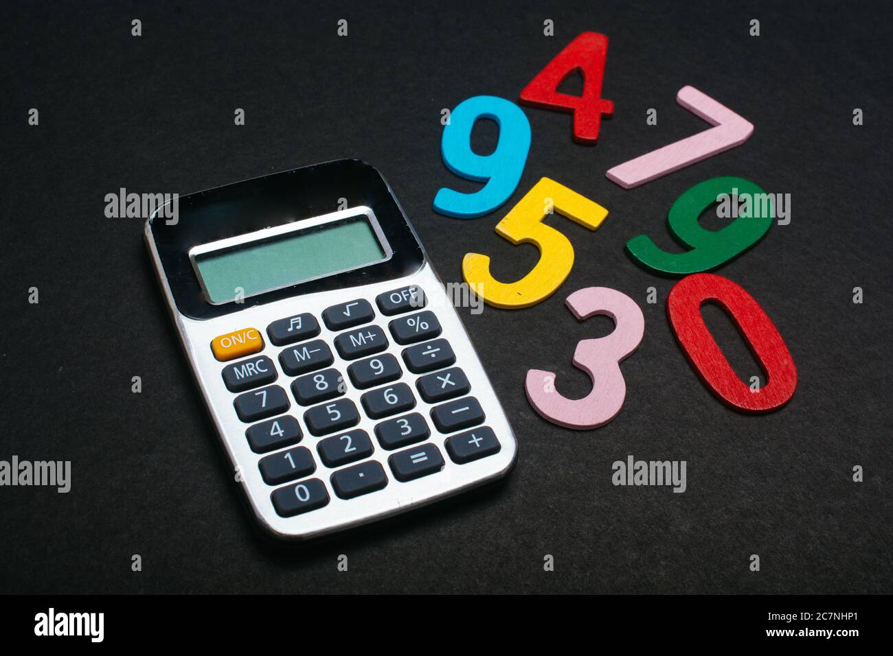 Mathematics learning concept. Colored numbers beside calculator Stock ...