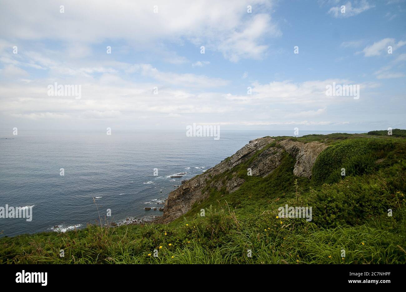 High angle shot of a beach surrounded with cliffs captured on a bright ...