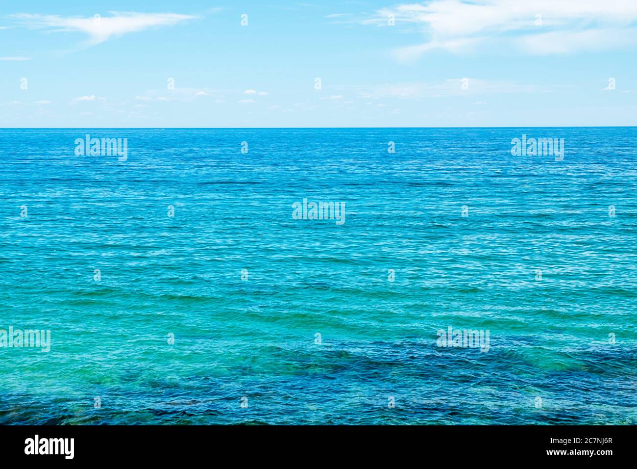 The ocean on a sunny day, ideal for background or wallpaper Stock Photo ...