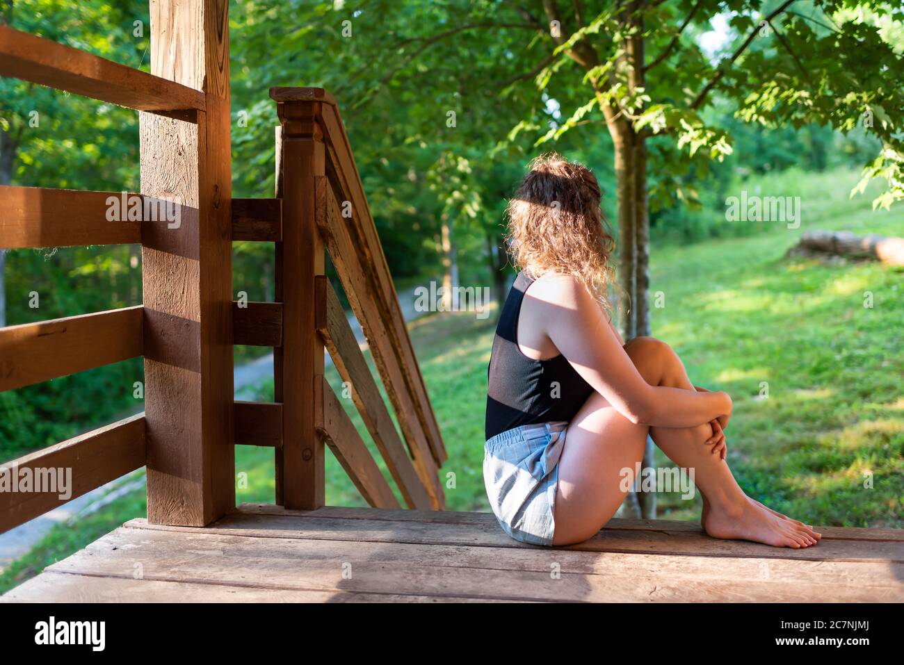 Woman Sitting Outside Log Cabin High Resolution Stock Photography and ...