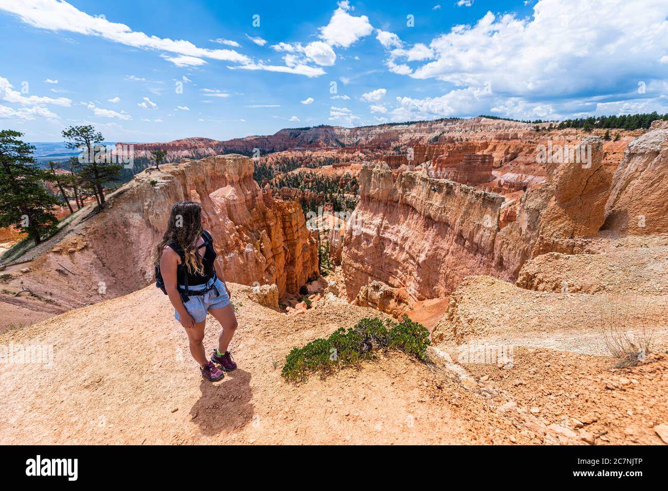 Woman tourist person standing looking at Sunset Point Overlook cliff ...