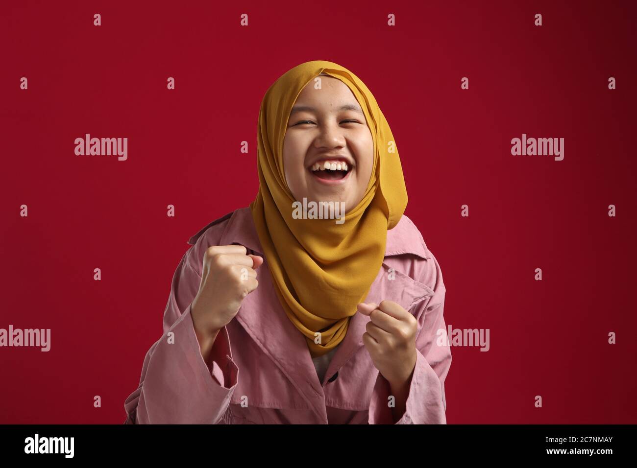 Portrait of happy success confident young teenage Asian muslim girl ...