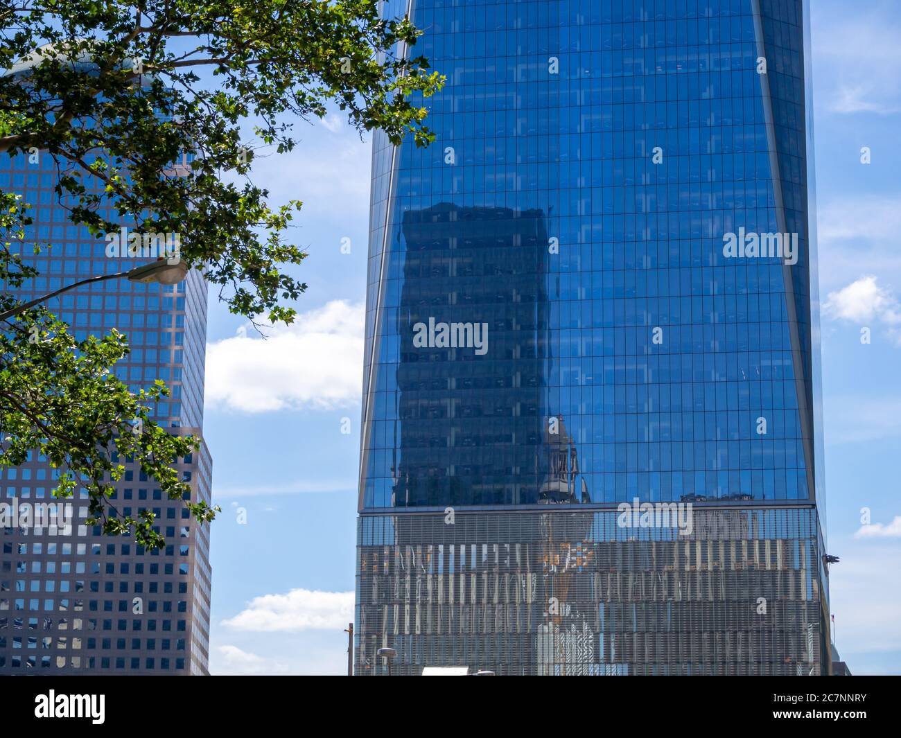 Reflections on World Trade Center downtown New York City in summer ...
