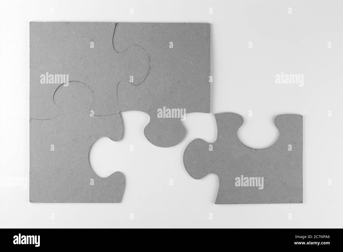 Gray jigsaw puzzle parts isolated on a white background Stock Photo - Alamy
