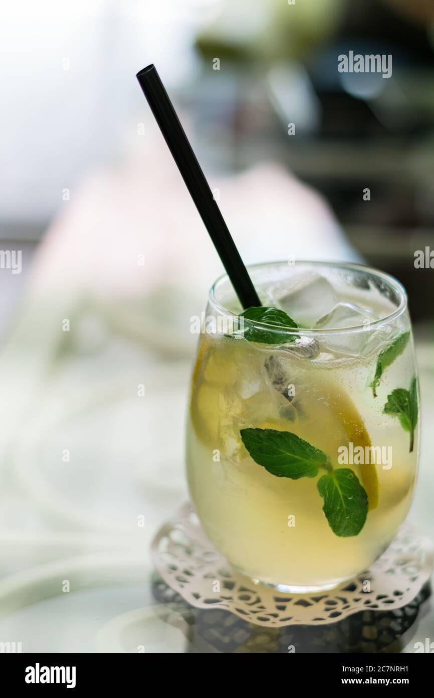 Closeup shot of an icy cocktail with mint and lemon Stock Photo - Alamy